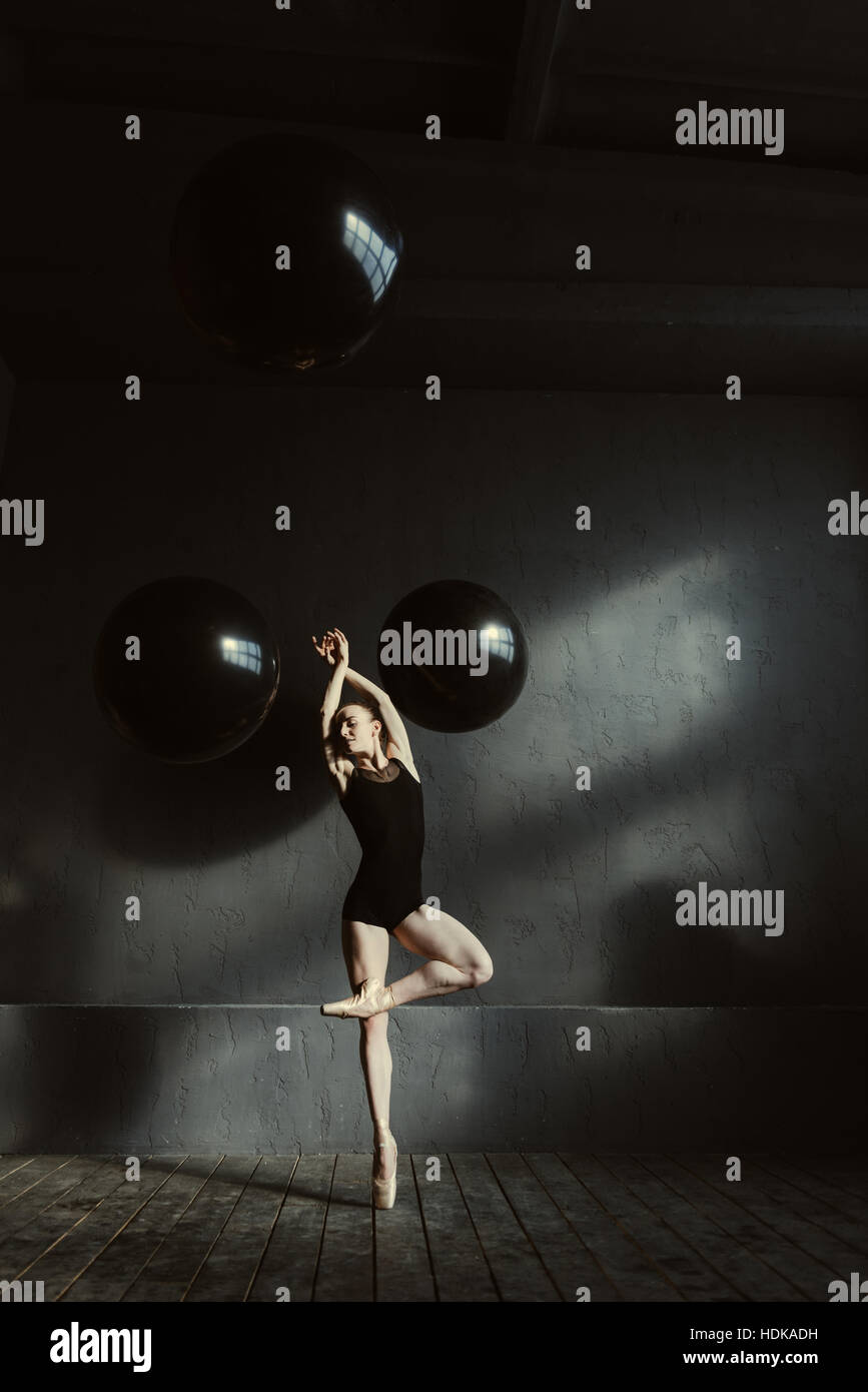 Feminine ballet dancer expressing elegance in the studio Stock Photo ...