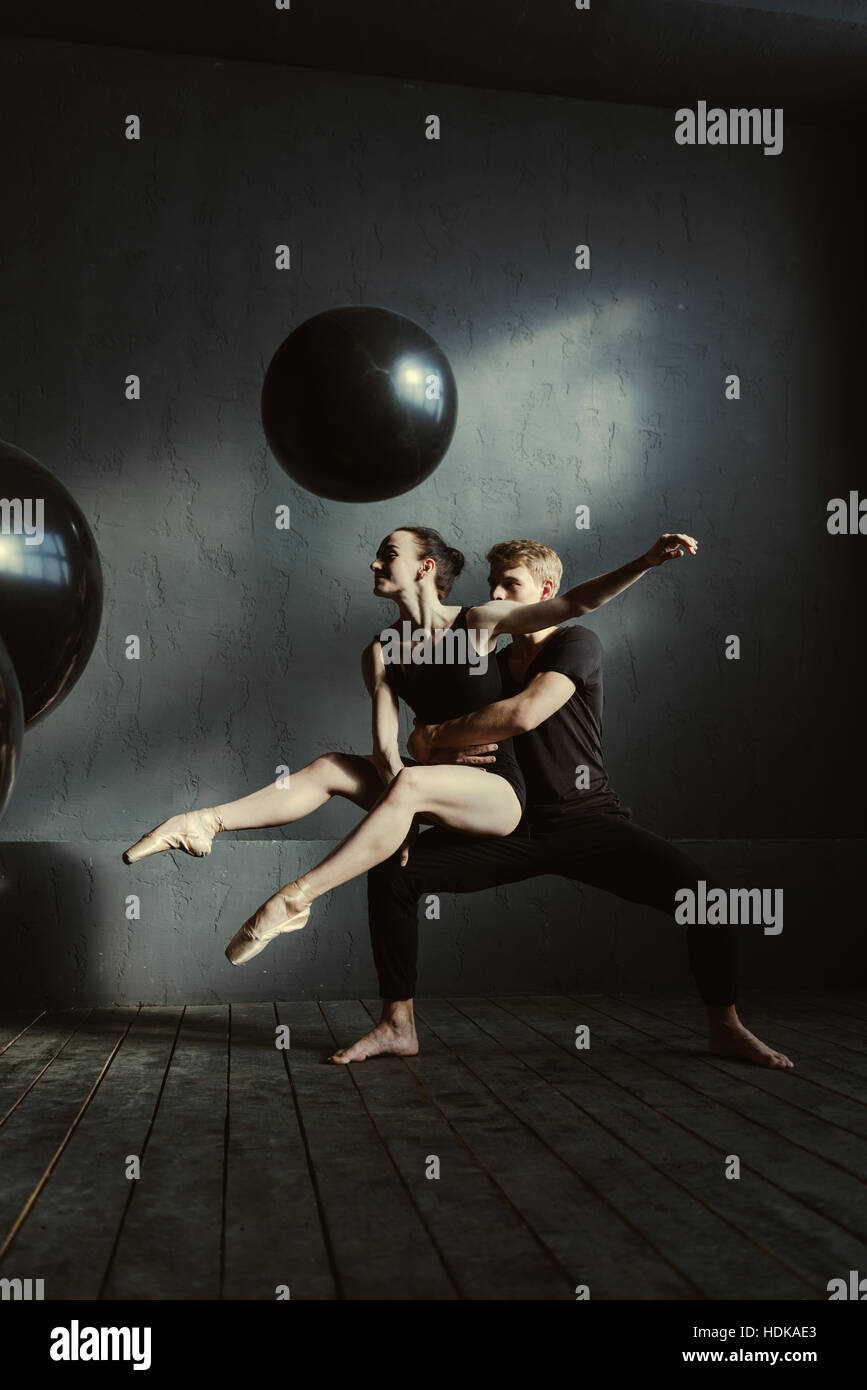 Smiling positive ballet dancers performing in the studio Stock Photo ...