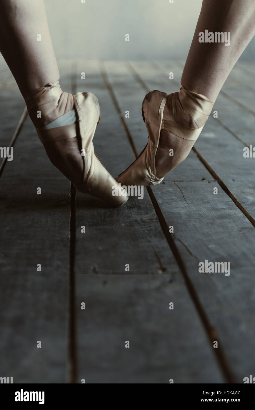 Ballet dancer stretching on tiptoes in the black room Stock Photo - Alamy