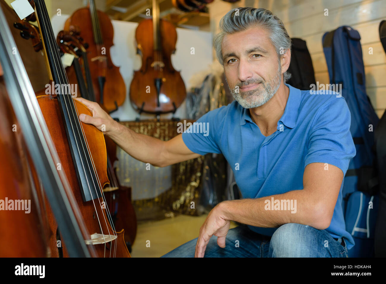 Portrait of man with cello Stock Photo - Alamy