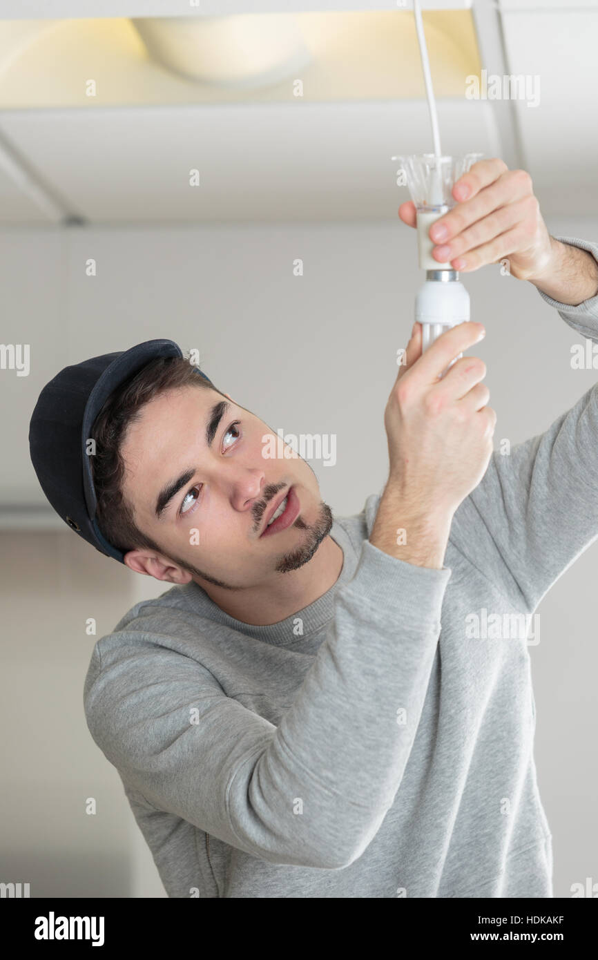 handsome young electrician working at construction site Stock Photo - Alamy