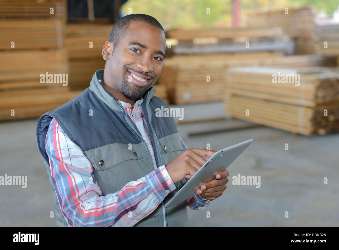 worker using a tablet Stock Photo - Alamy