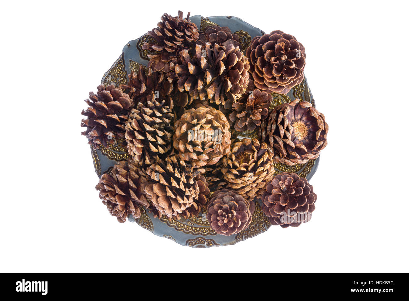 Overhead view of several Natural Pine cones in center table piece plate ...