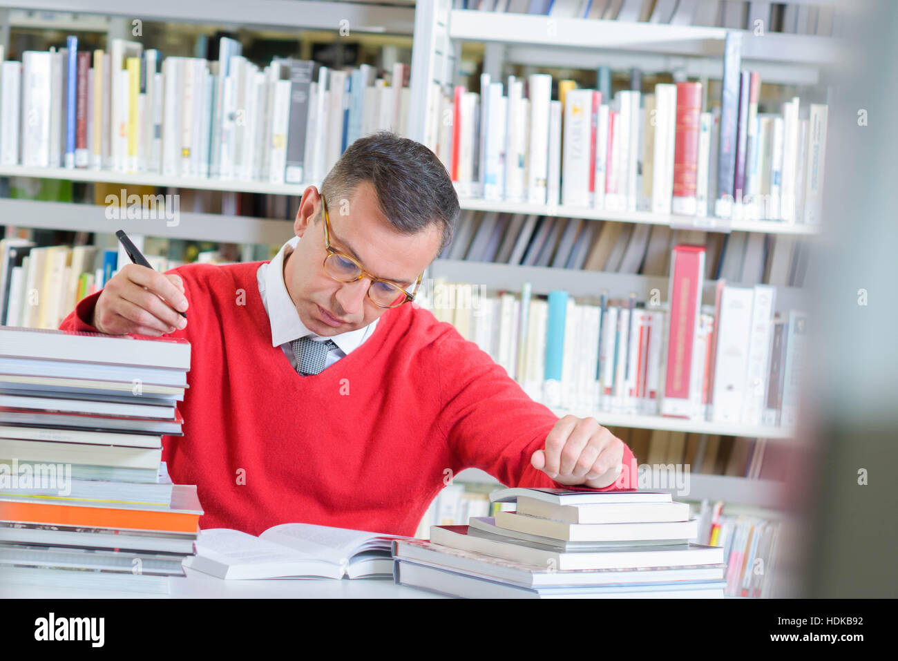 busy reader in the library Stock Photo - Alamy
