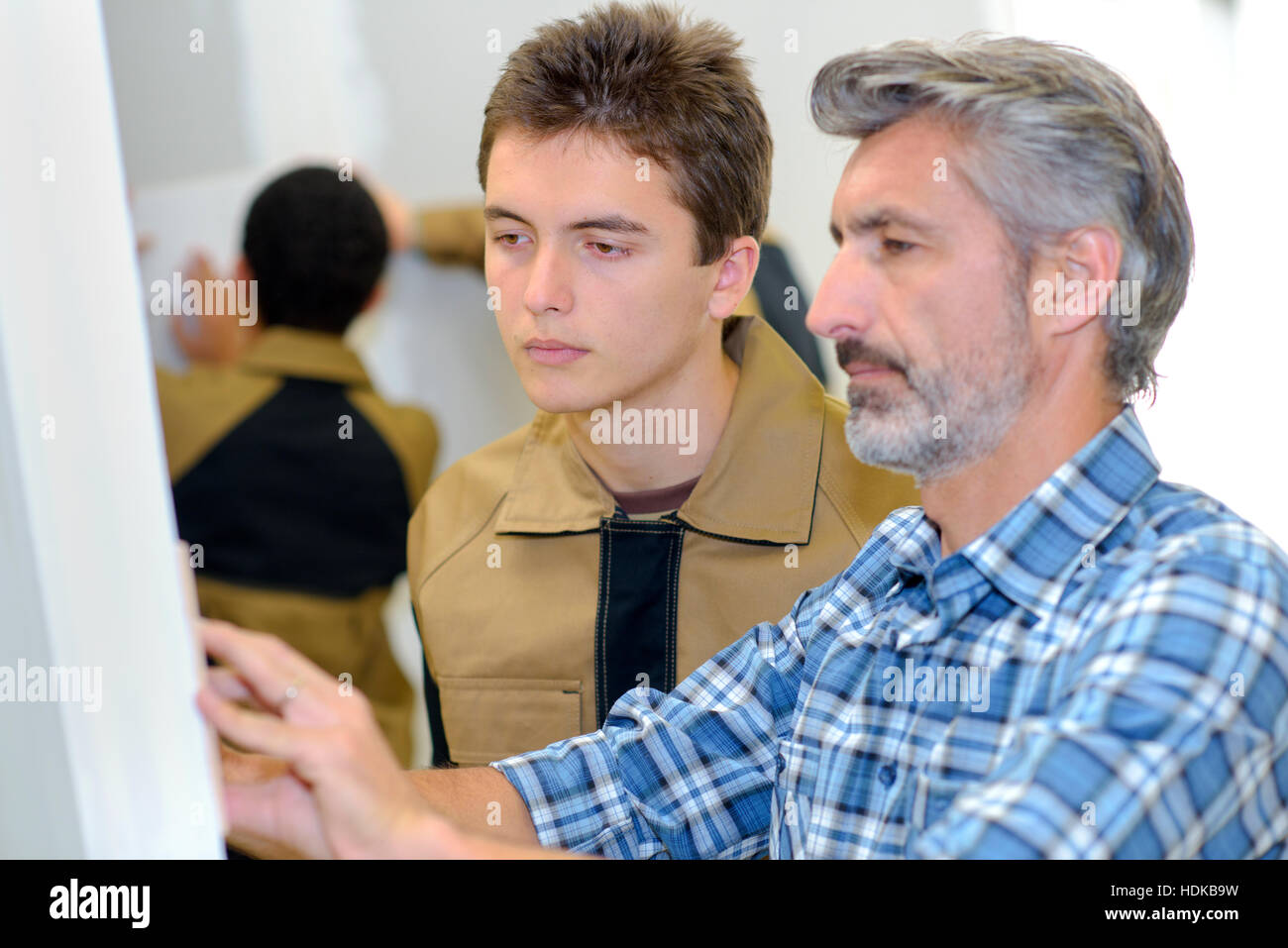 Tutor and apprentice Stock Photo - Alamy