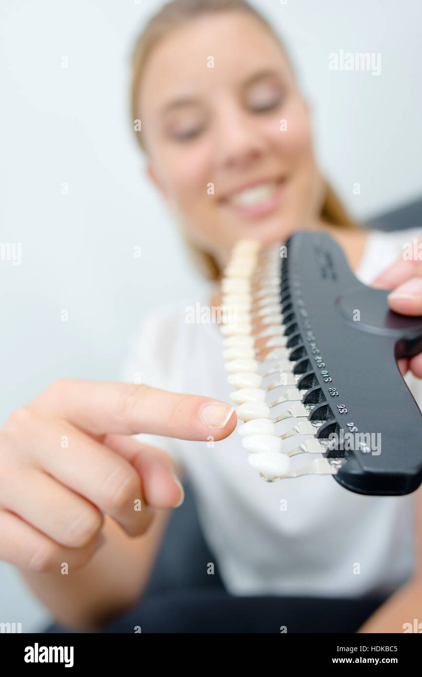 Young woman pointing at an item Stock Photo - Alamy