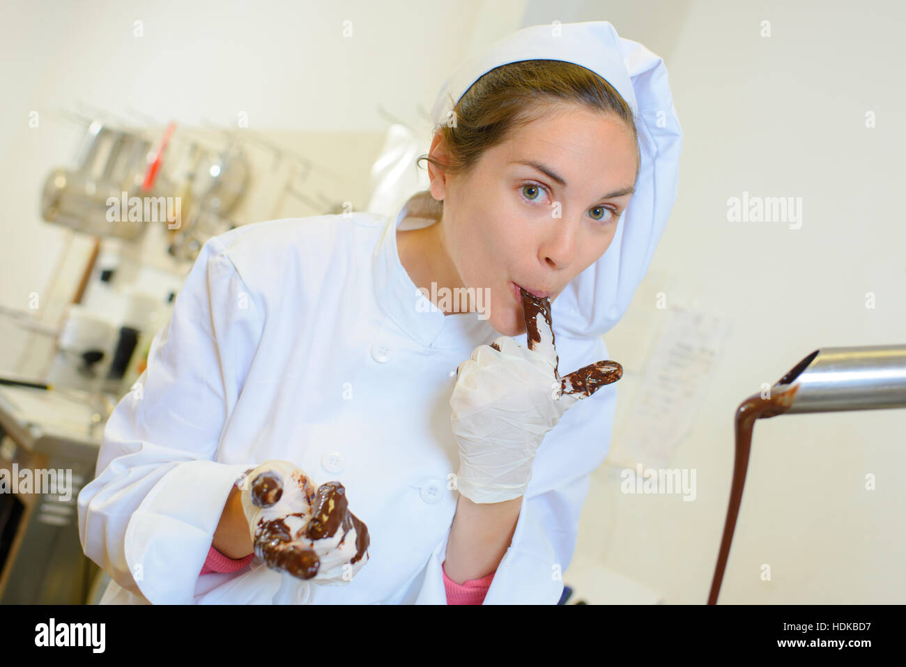 Woman mouth eating chocolate cake hi-res stock photography and images ...