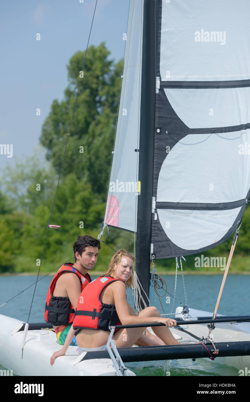 Couple on catamaran Stock Photo - Alamy