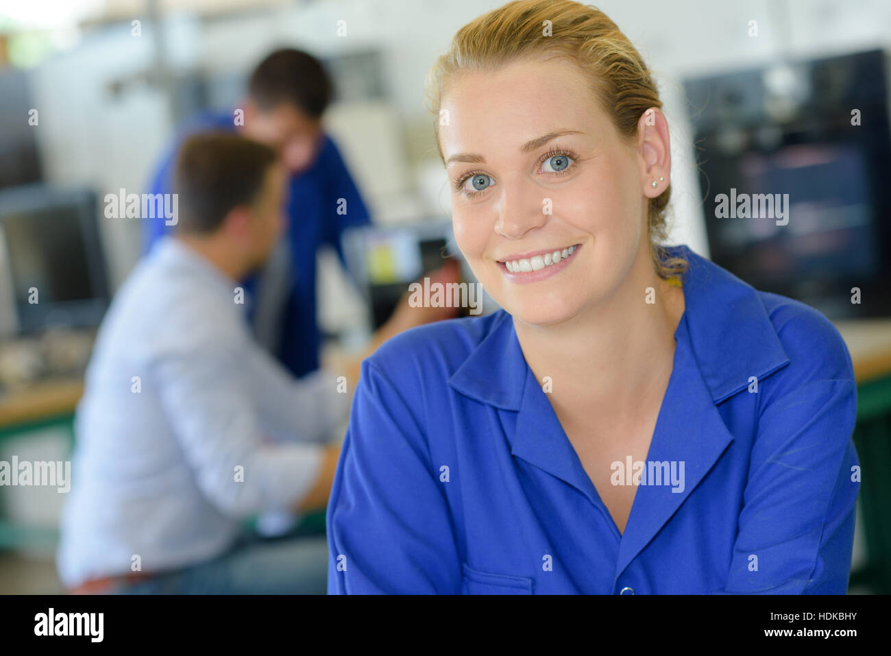 lady worker smiling Stock Photo - Alamy