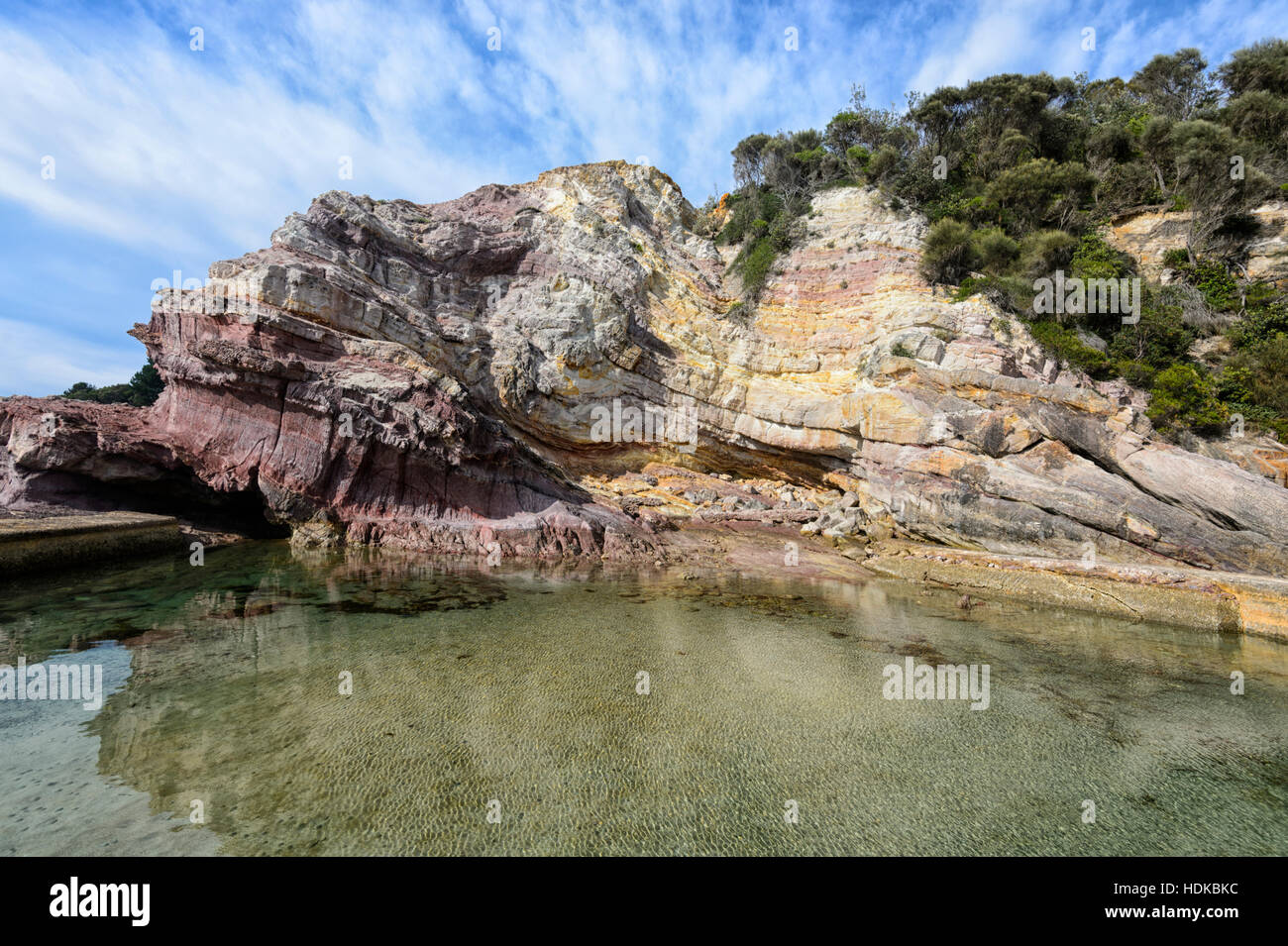 Eden Rock Pool next to Palaeozoic sedimentary rock formations part of ...