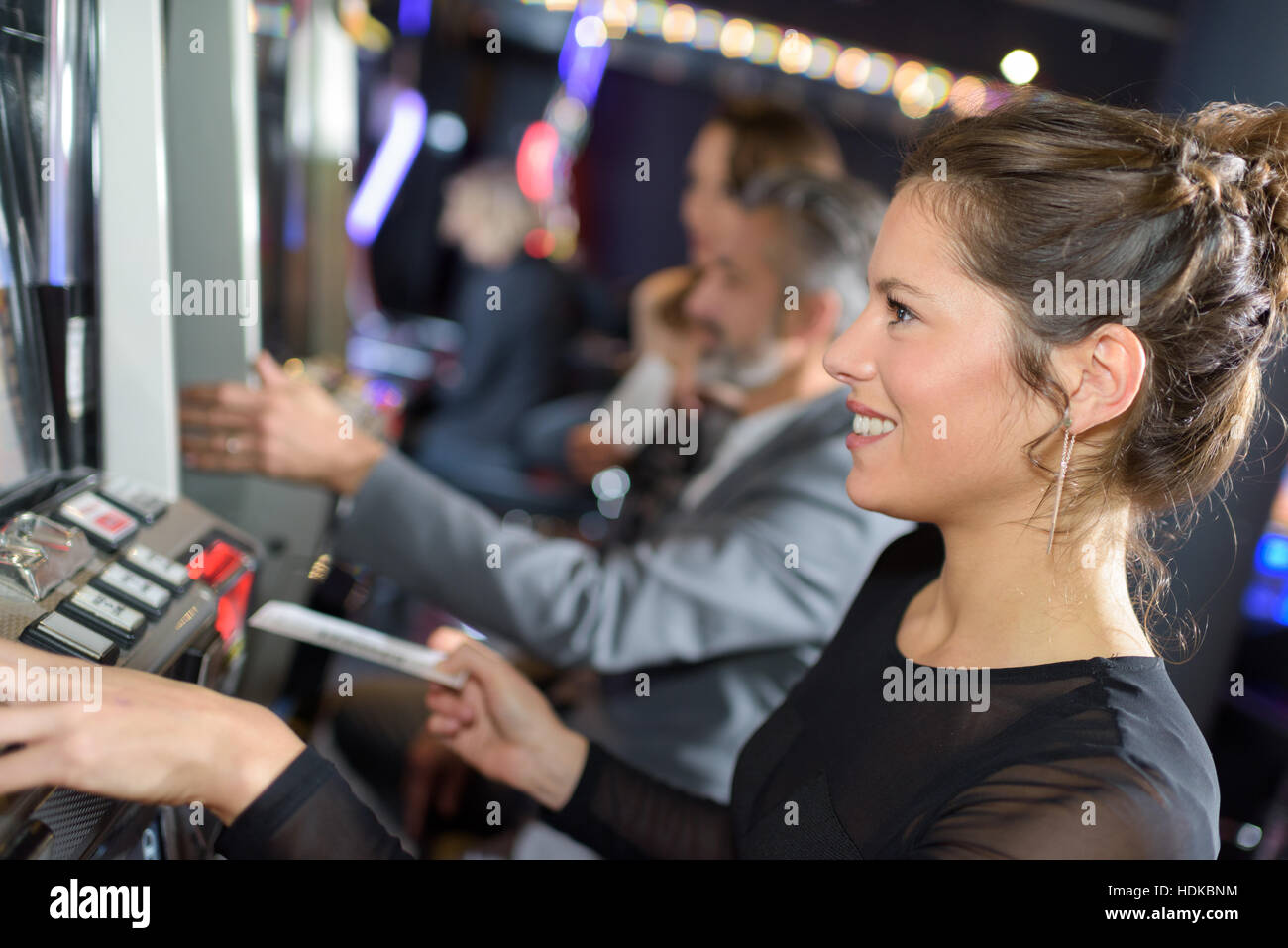 Woman playing arcade game Stock Photo - Alamy