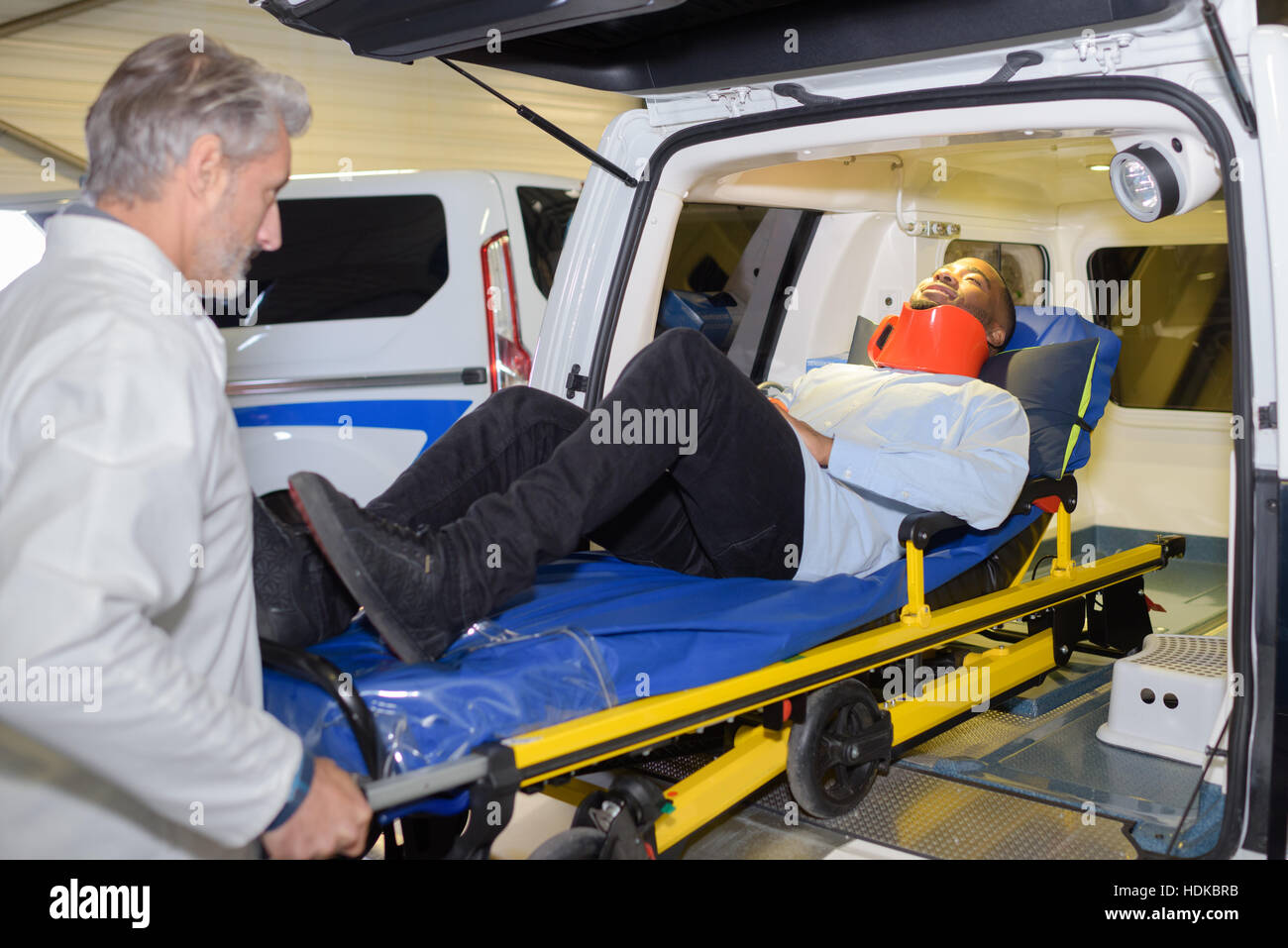 Patient being unloaded from ambulance Stock Photo - Alamy
