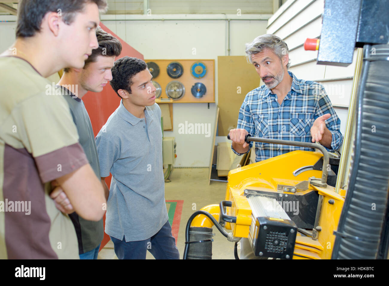 teacher showing machinery Stock Photo - Alamy