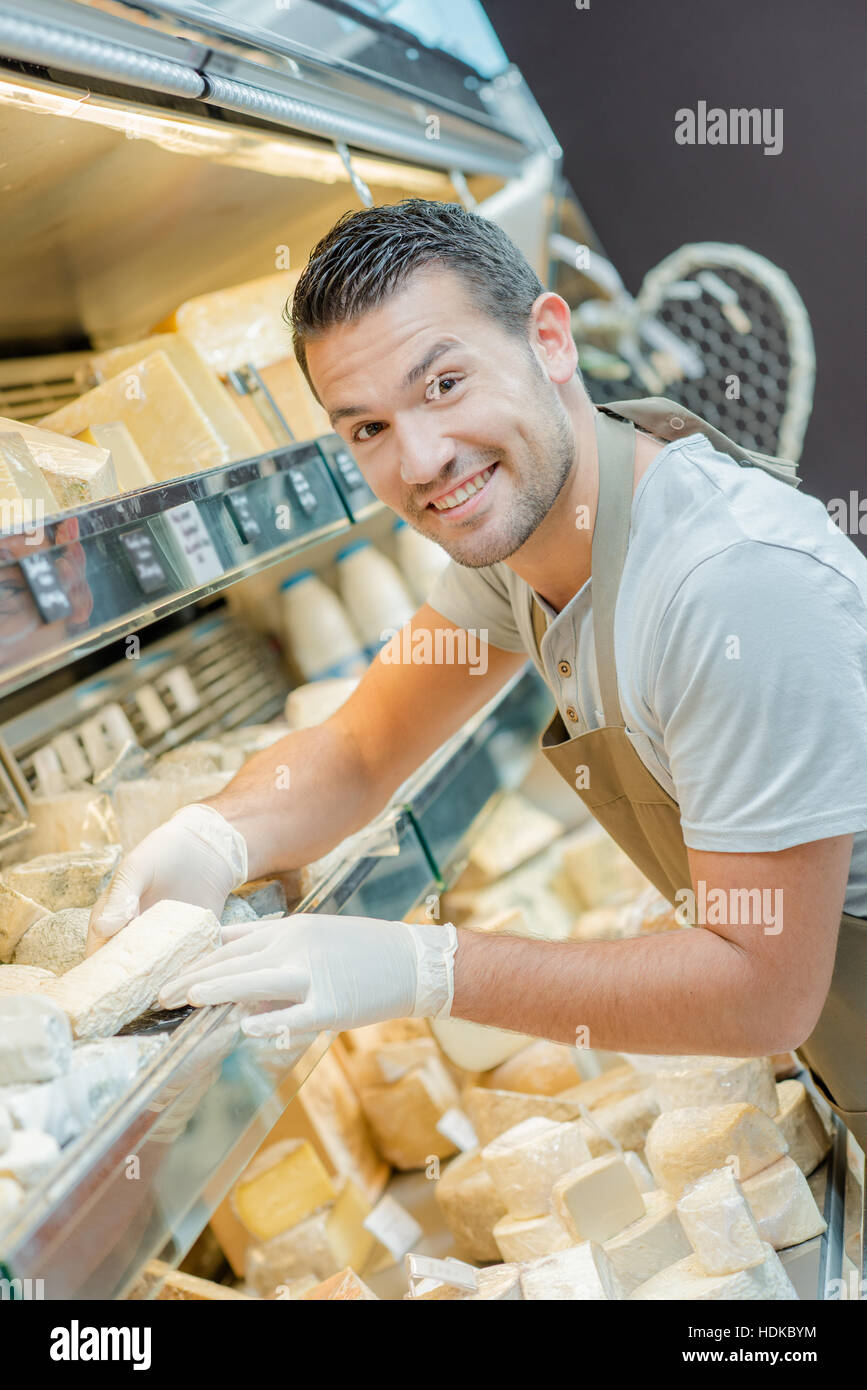 man at cheese counter Stock Photo - Alamy