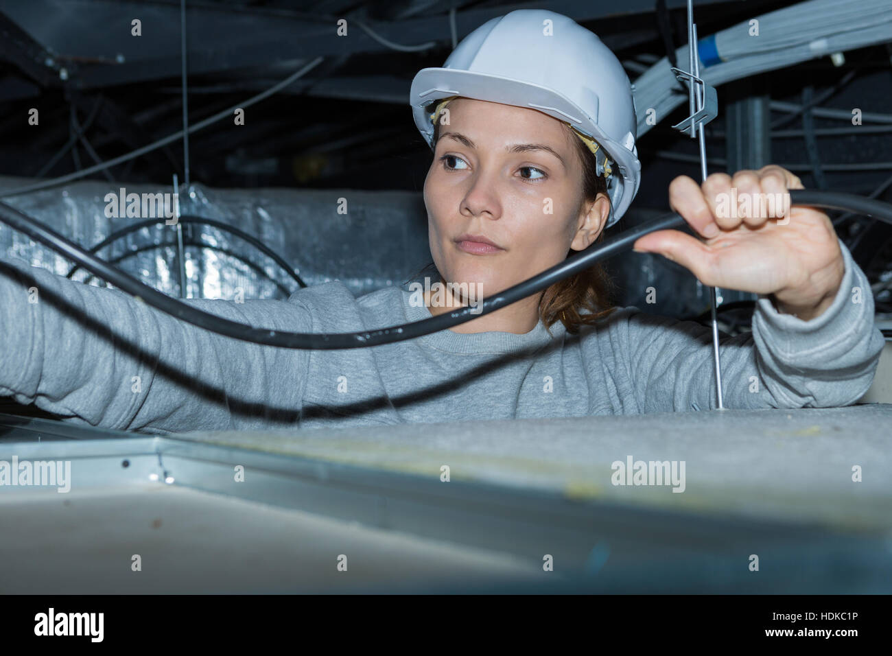 woman electrician checking a wire Stock Photo - Alamy
