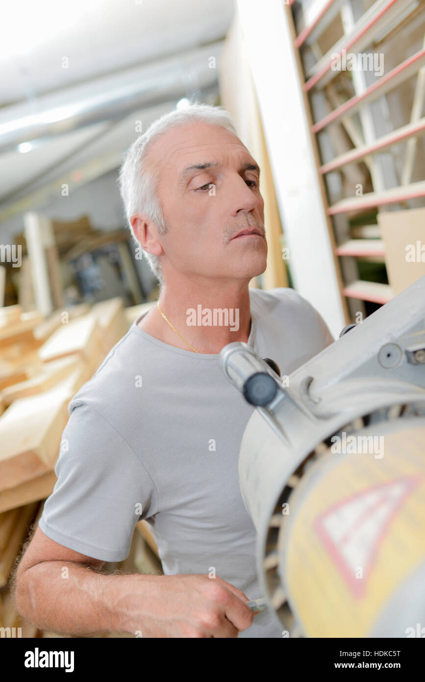 carpenter with machine Stock Photo - Alamy