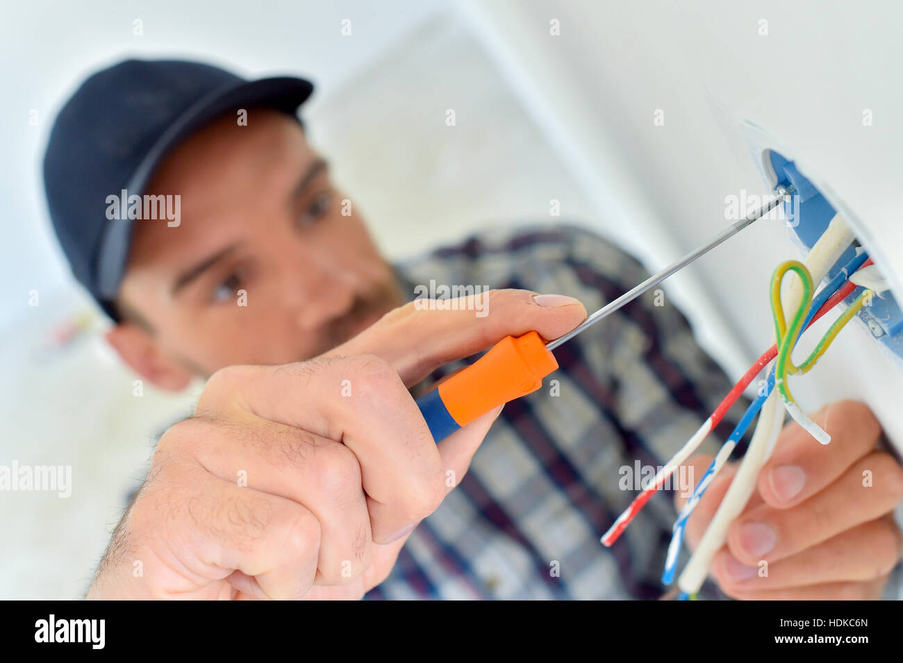 Electrician wiring a new build Stock Photo - Alamy