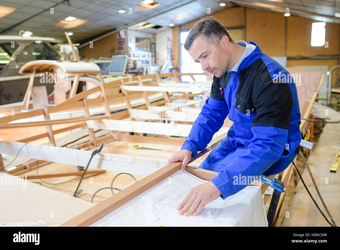 engineer following plans building yachts Stock Photo - Alamy