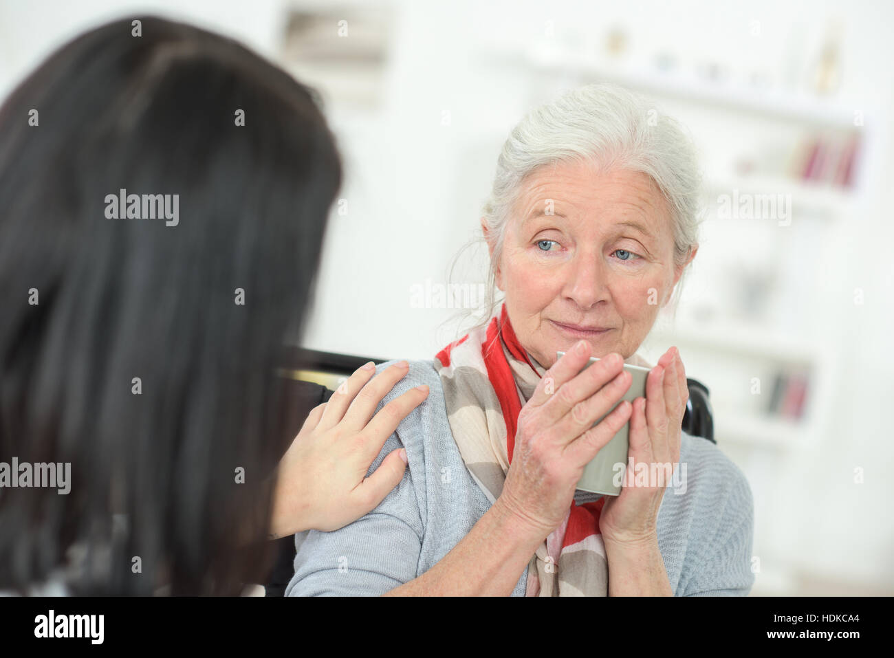 Sad looking old woman at home Stock Photo - Alamy