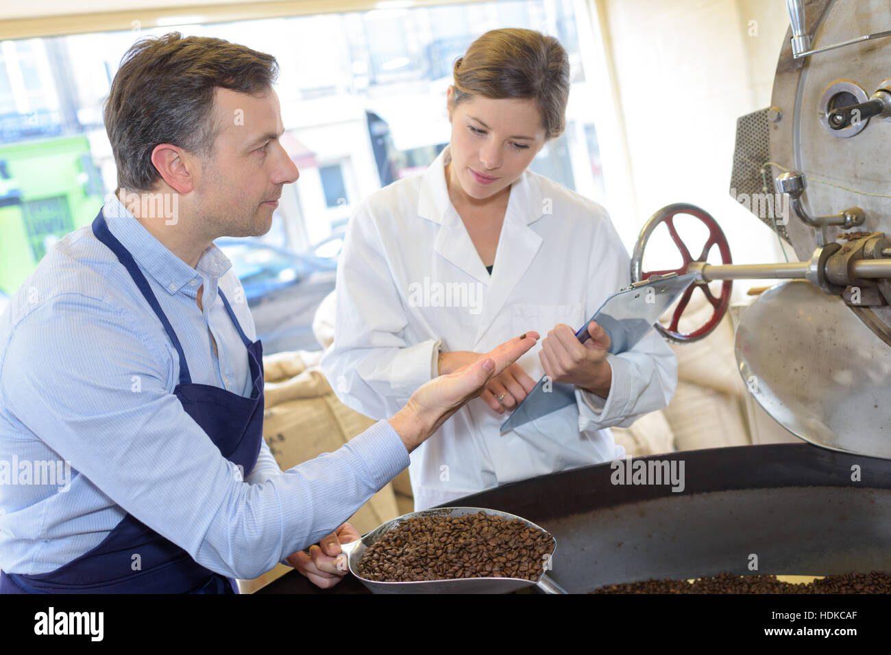 testing coffee beans on the degree of roasting Stock Photo - Alamy