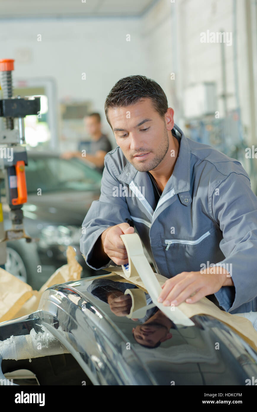 Preparing a car before spray painting Stock Photo - Alamy