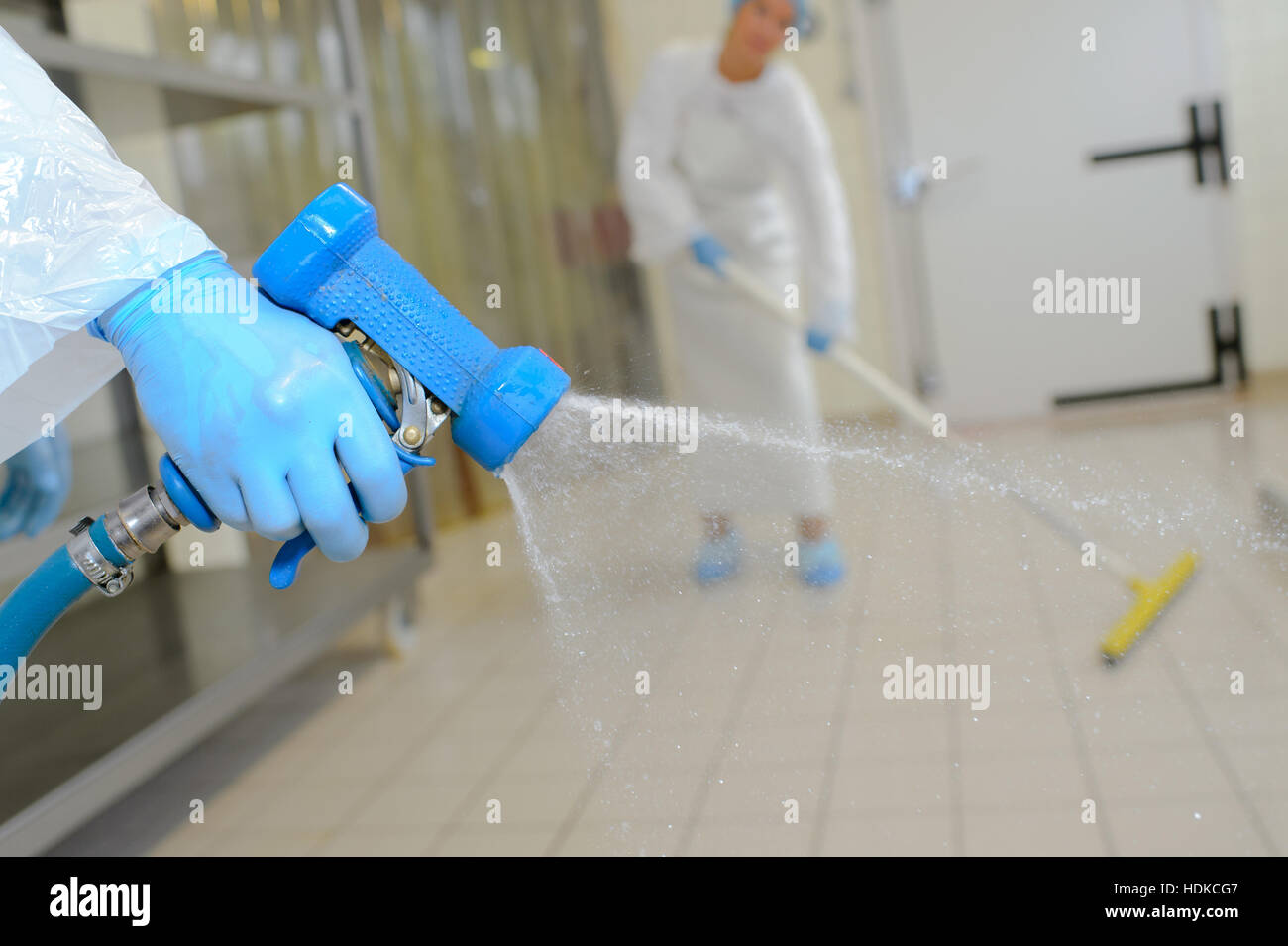 hosing down work space Stock Photo - Alamy