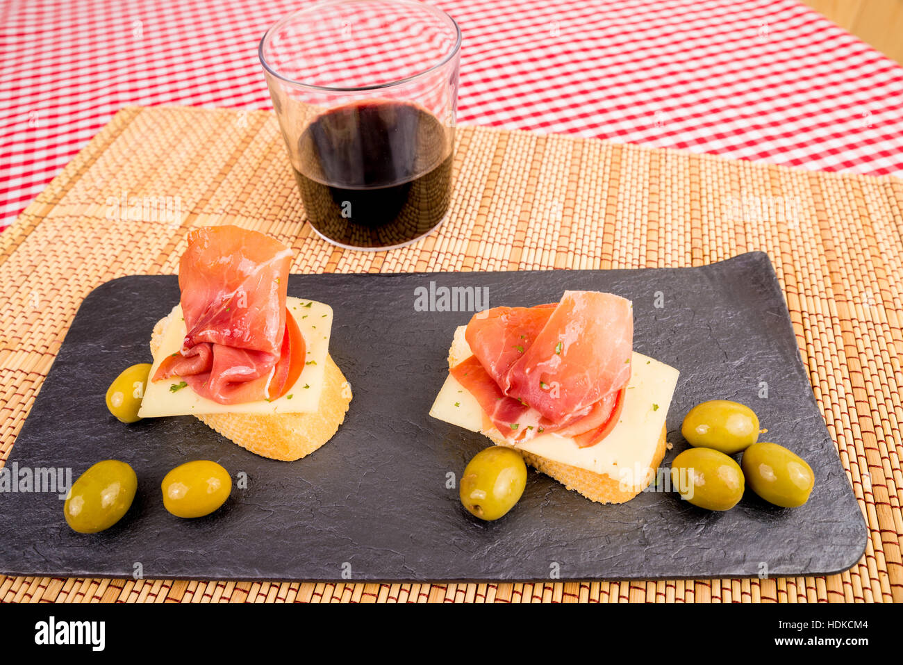 Traditional Spanish pincho style serrano ham tapa Stock Photo - Alamy