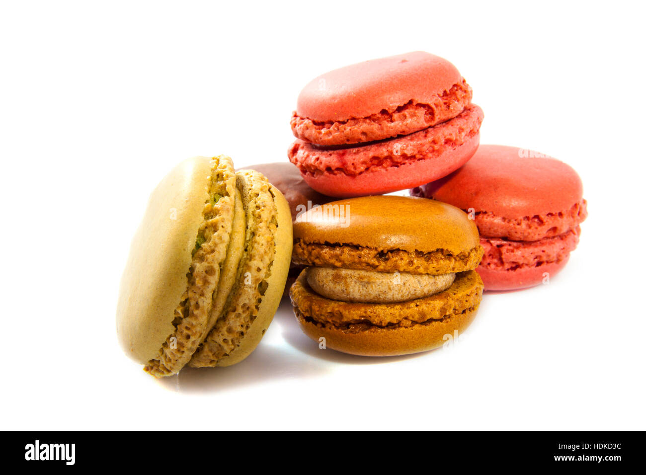 Macarons on a pile isolated over white Stock Photo - Alamy