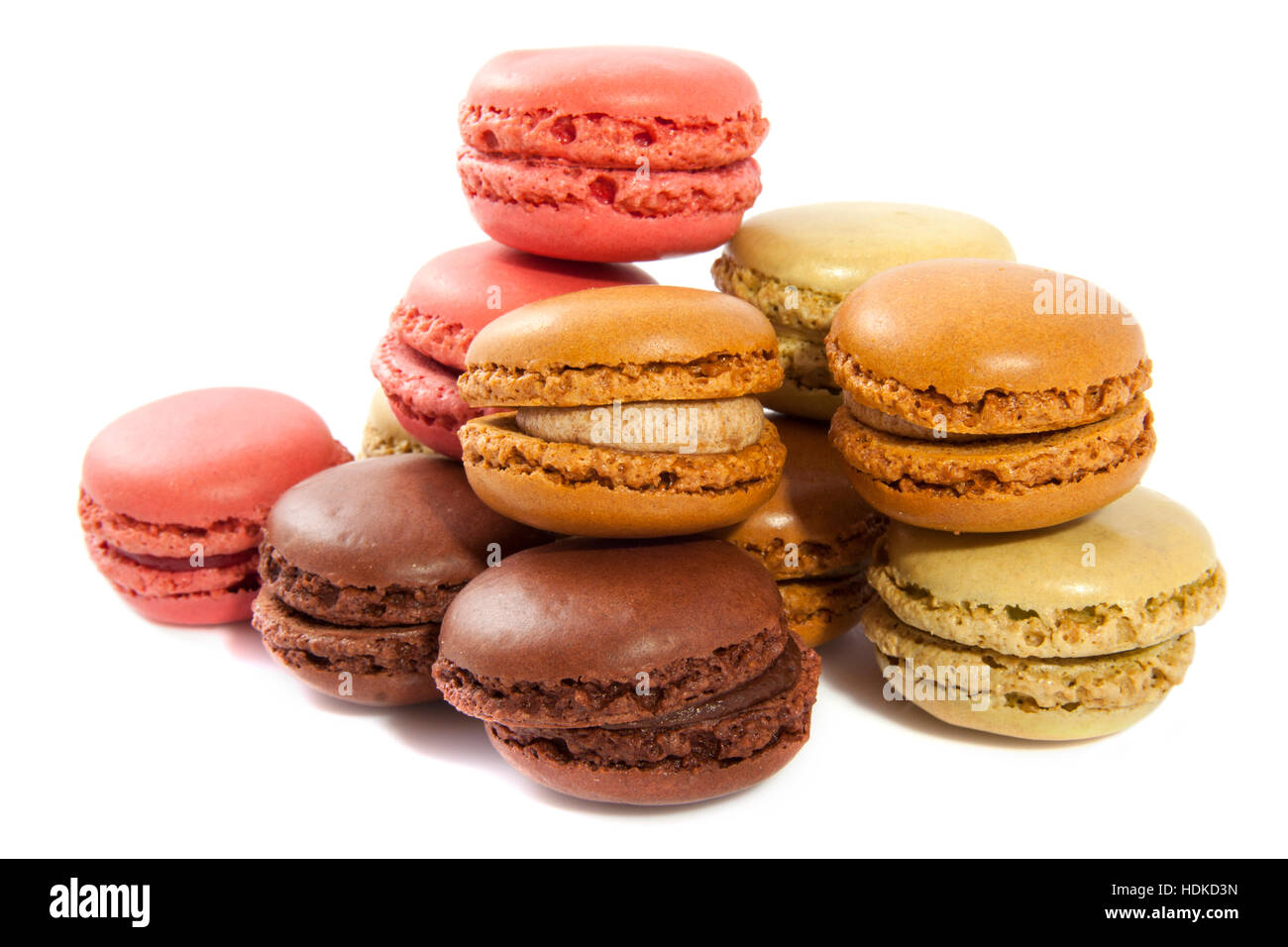 Macarons on a pile isolated over white Stock Photo - Alamy