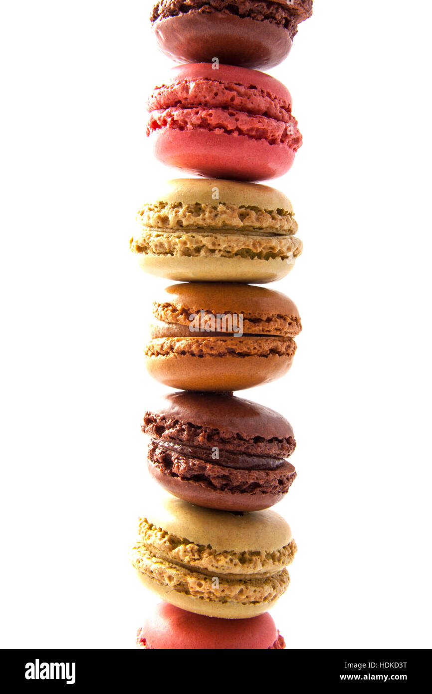 Macarons on a pile isolated over white Stock Photo - Alamy