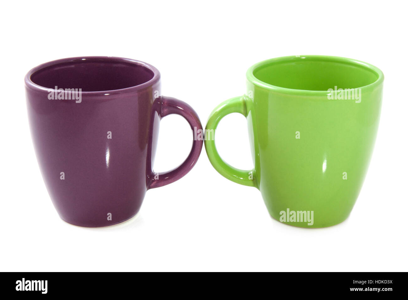 Two colorful cups closeup isolated over white Stock Photo - Alamy
