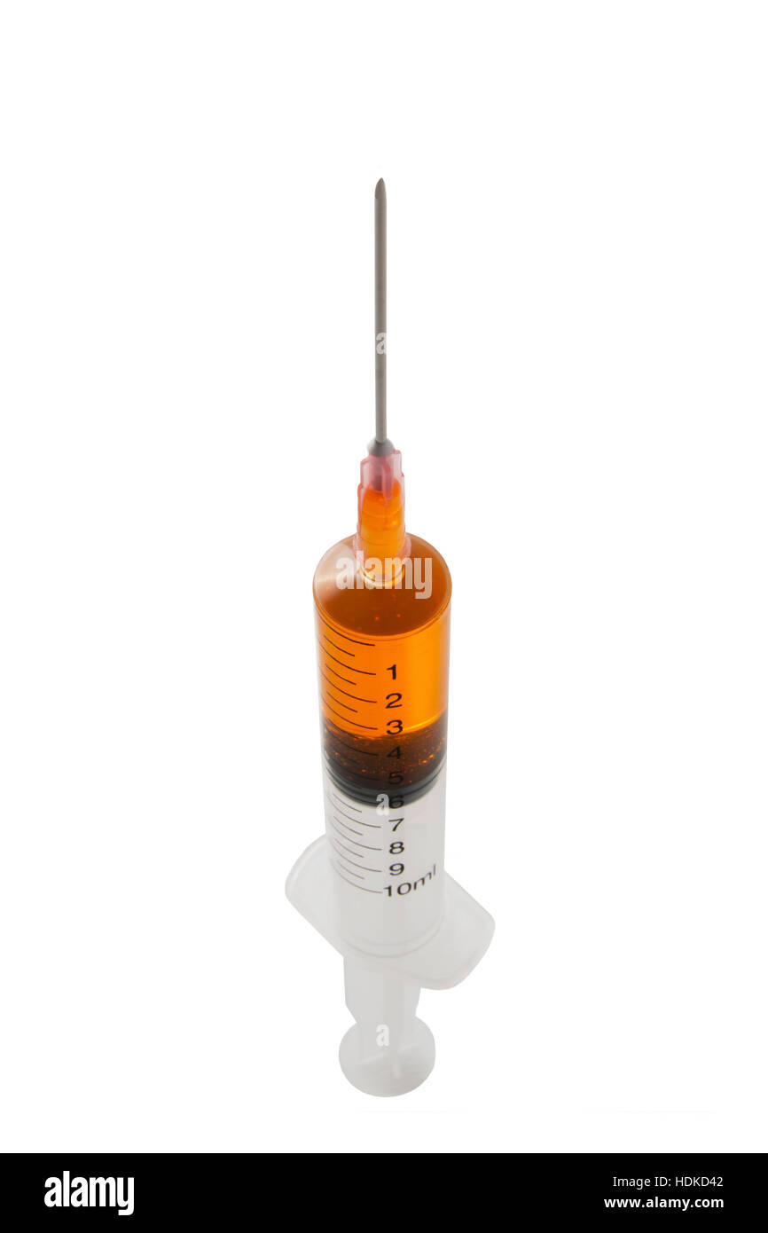 Injection with orange liqiud isolated over white Stock Photo - Alamy