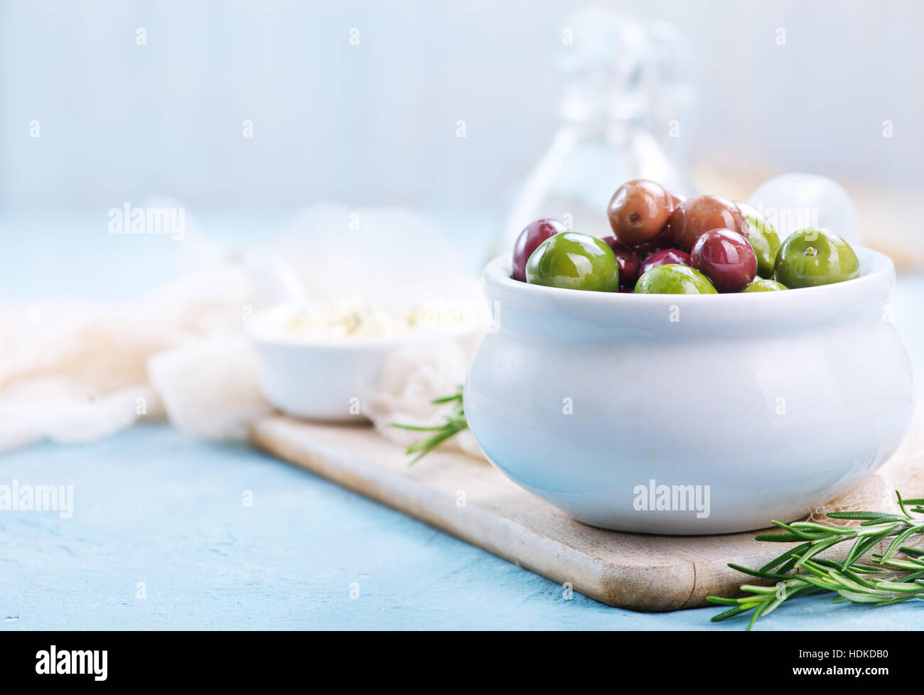 olives in bowl and on a table Stock Photo - Alamy