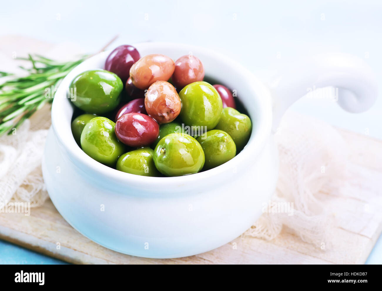 olives in bowl and on a table Stock Photo - Alamy
