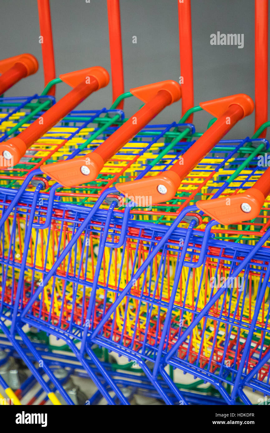 many shopping colorful shopping trolleys together Stock Photo - Alamy
