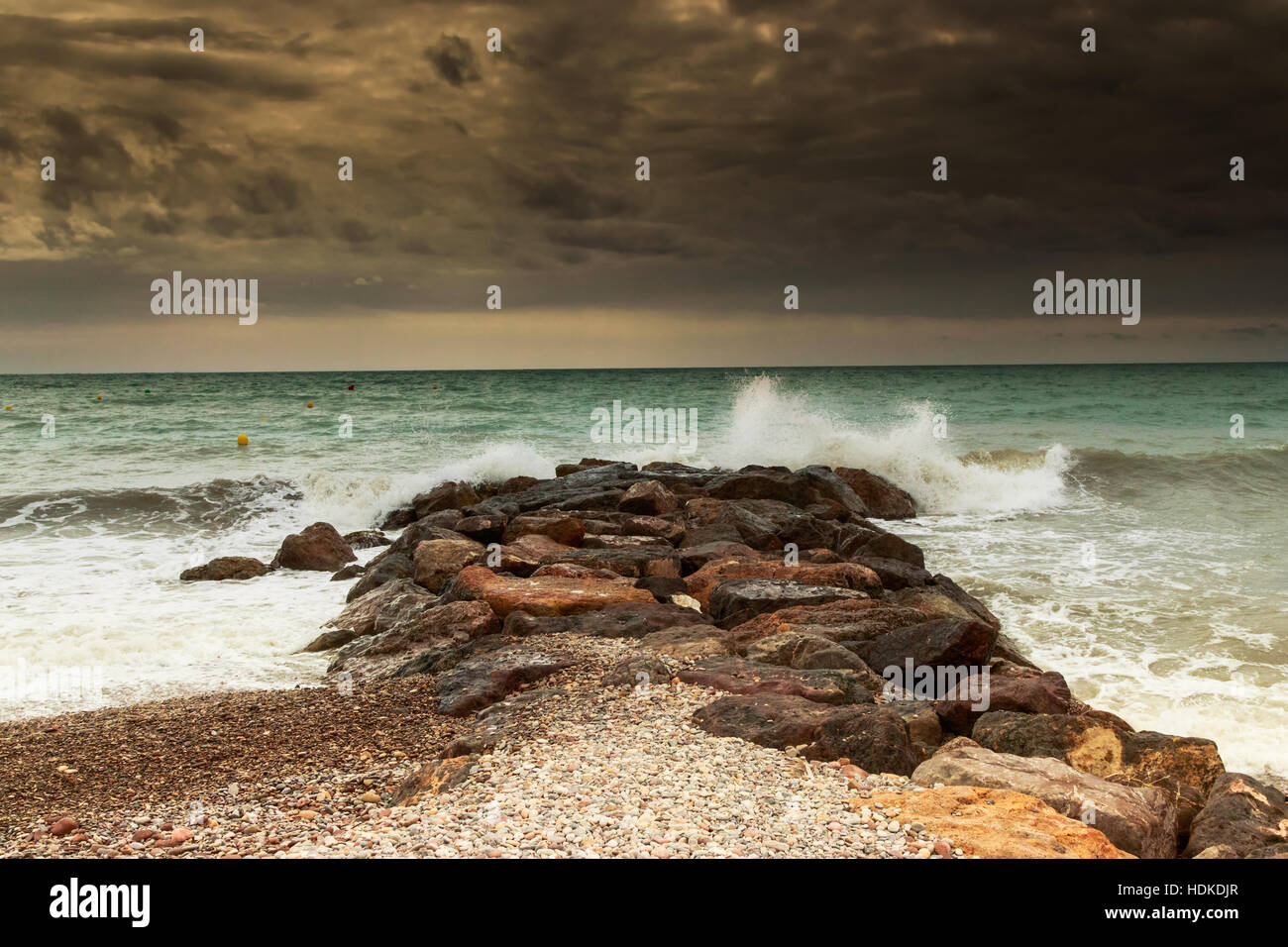 Storm over breakwaters of the beach. Horizontal image Stock Photo - Alamy