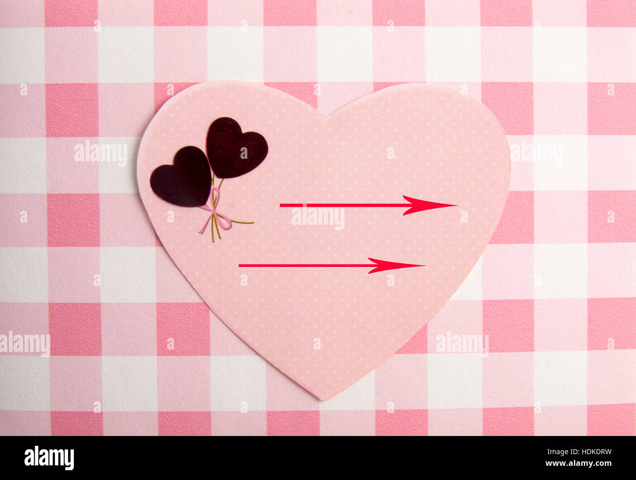 Pink heart on a checkered pink white background Stock Photo - Alamy