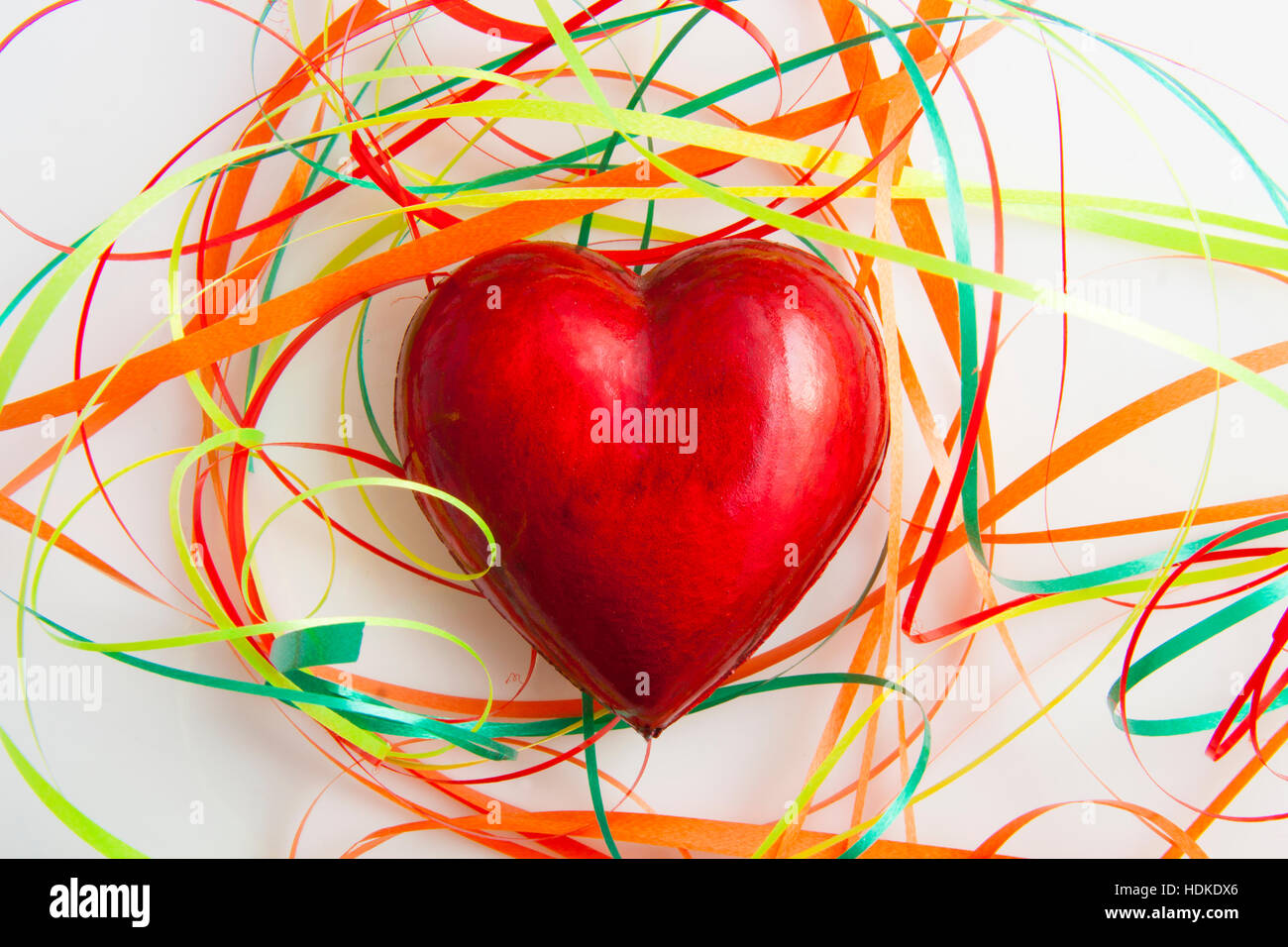 Red heart in colorful party style for background use Stock Photo - Alamy