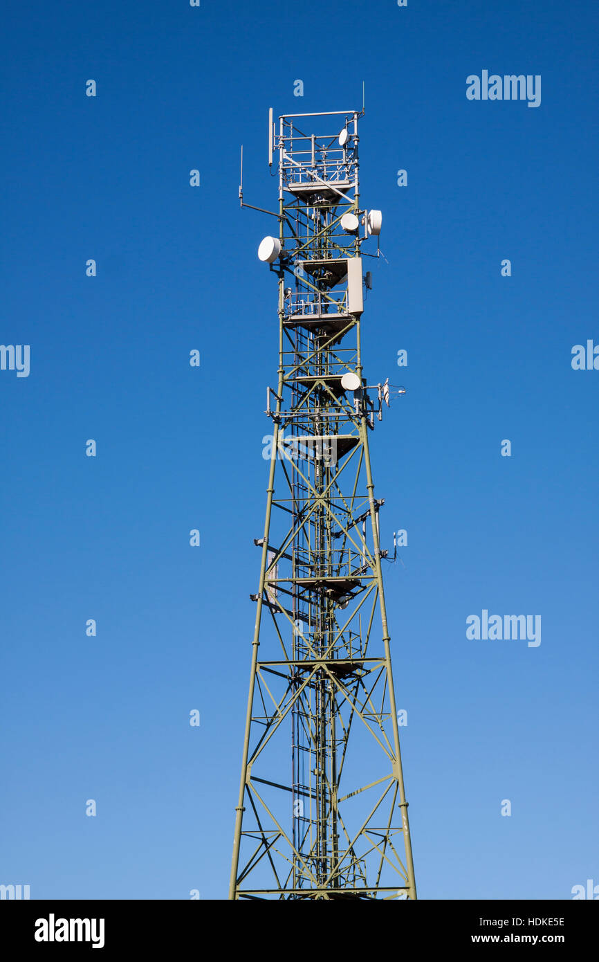 Communication tower with a blue sky background Stock Photo - Alamy