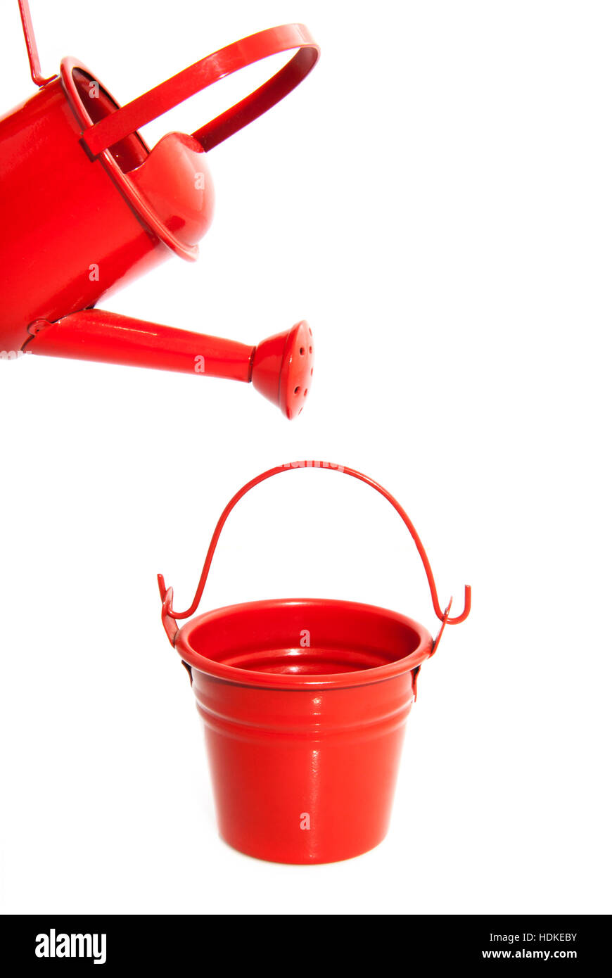 Red bucket and red watering can isolated over white Stock Photo - Alamy