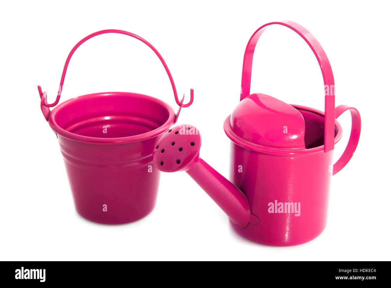 Pink bucket and pink watering can isolated over white Stock Photo - Alamy