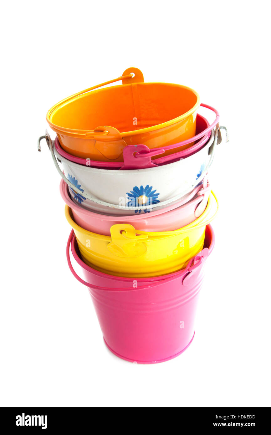 Colorful buckets on a pile isolated over white Stock Photo - Alamy
