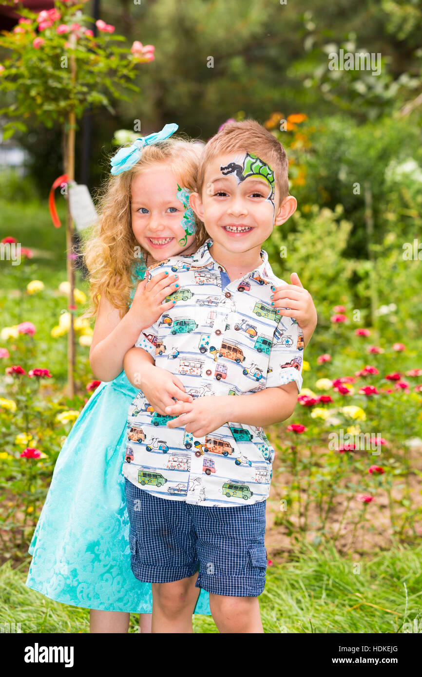 The boy and girl child with aqua make-up on happy birthday. Celebration ...