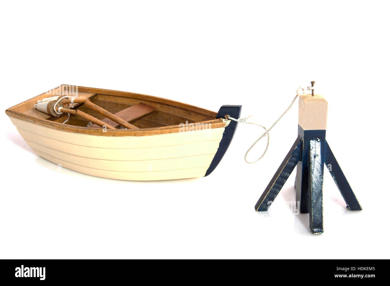 Small old wooden boat with buoy isolated over white Stock Photo - Alamy