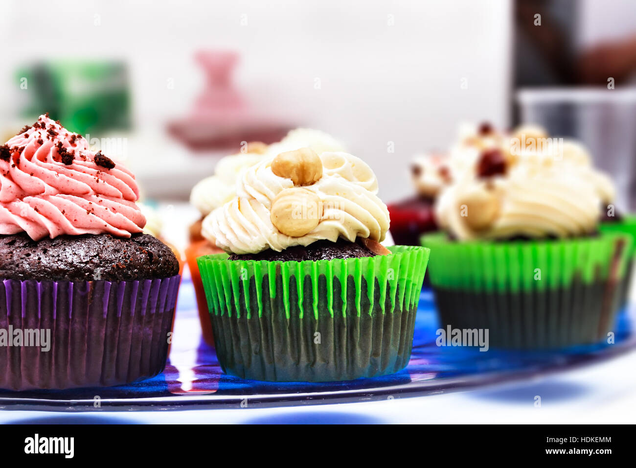 Cupcakes on a blue stand. Horizontal image Stock Photo - Alamy