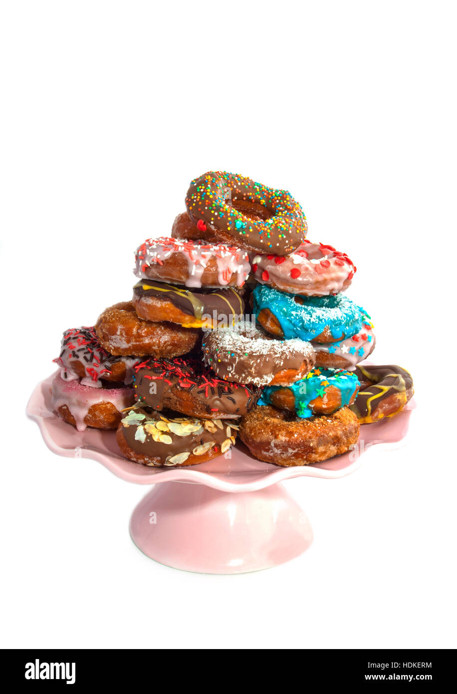 Decorated colorfull donuts with sweets on a pile isolated over white ...