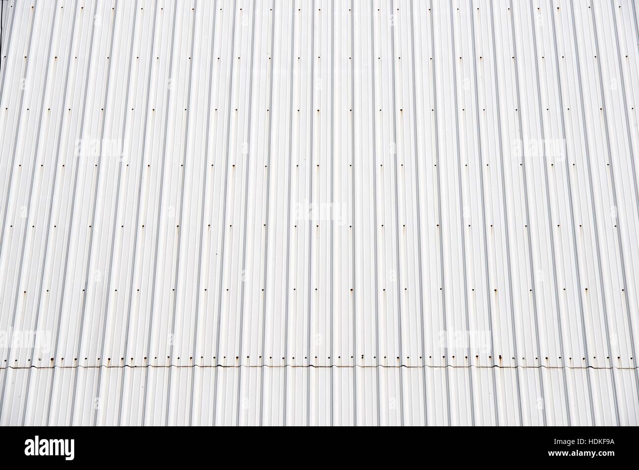 abstract background created by the surface of a metal roof industrial ...