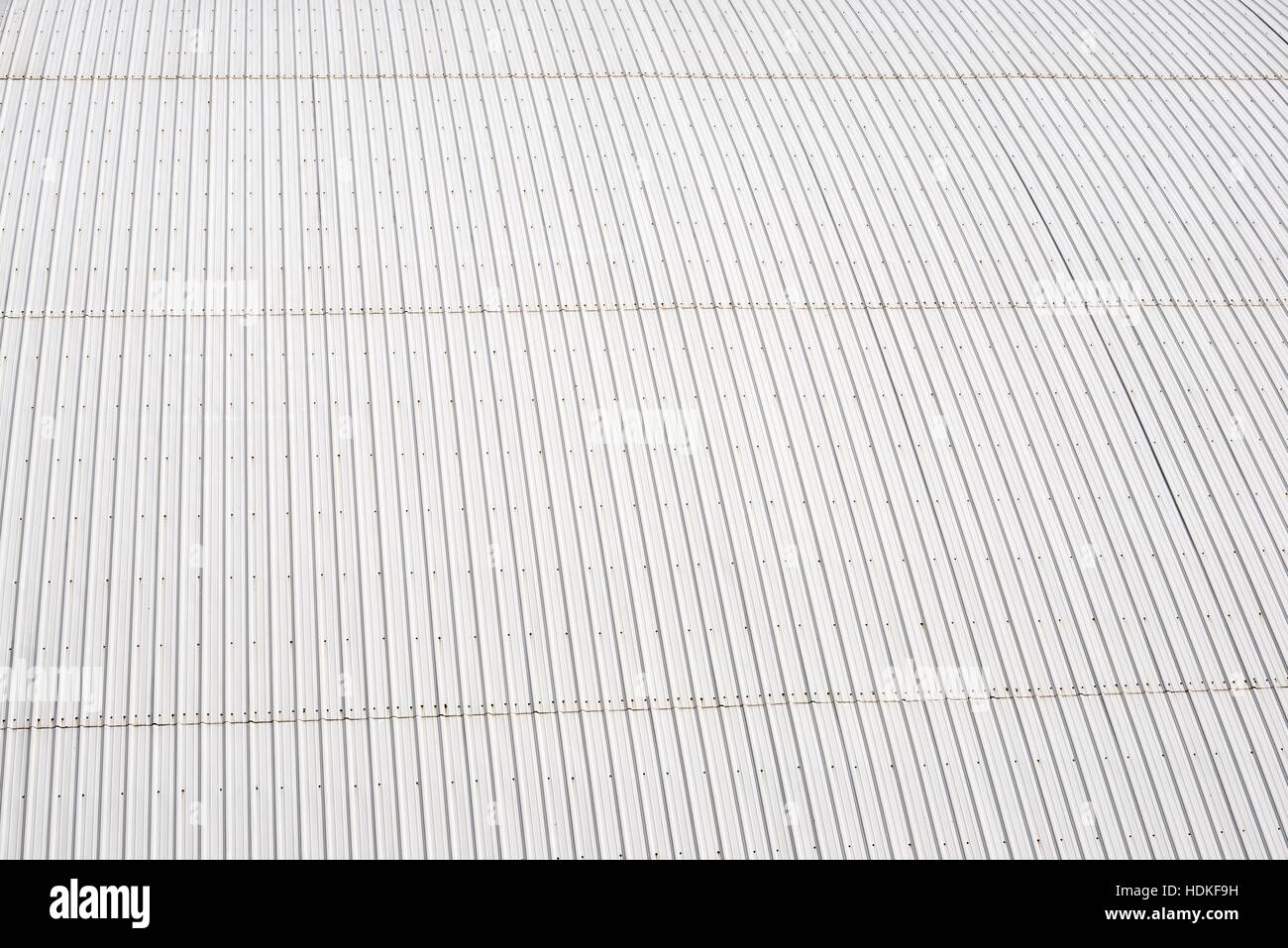 abstract background created by the surface of a metal roof industrial ...