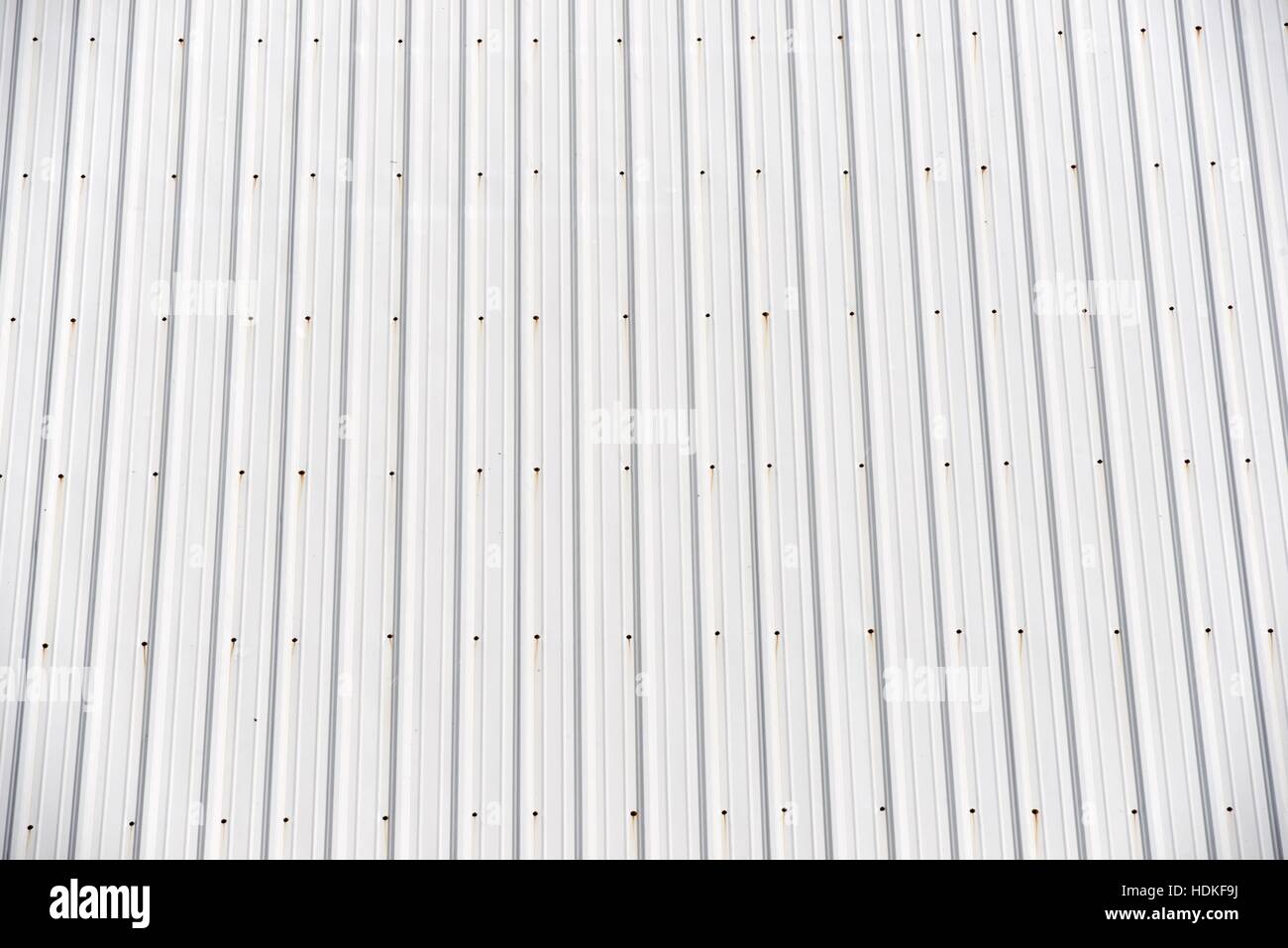 abstract background created by the surface of a metal roof industrial ...