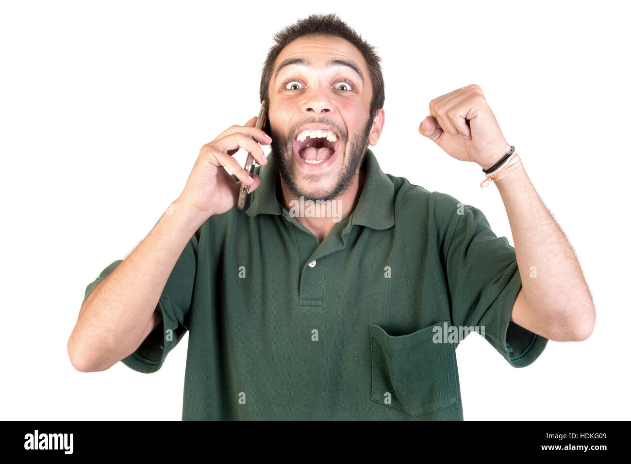 young man with cellphone doing funny faces isolated in white Stock ...